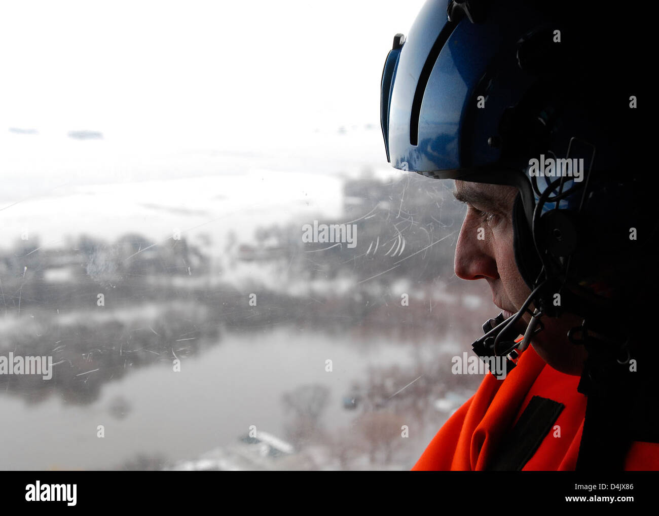 The aftermath of flooding is observed to assess the extent of damage ...