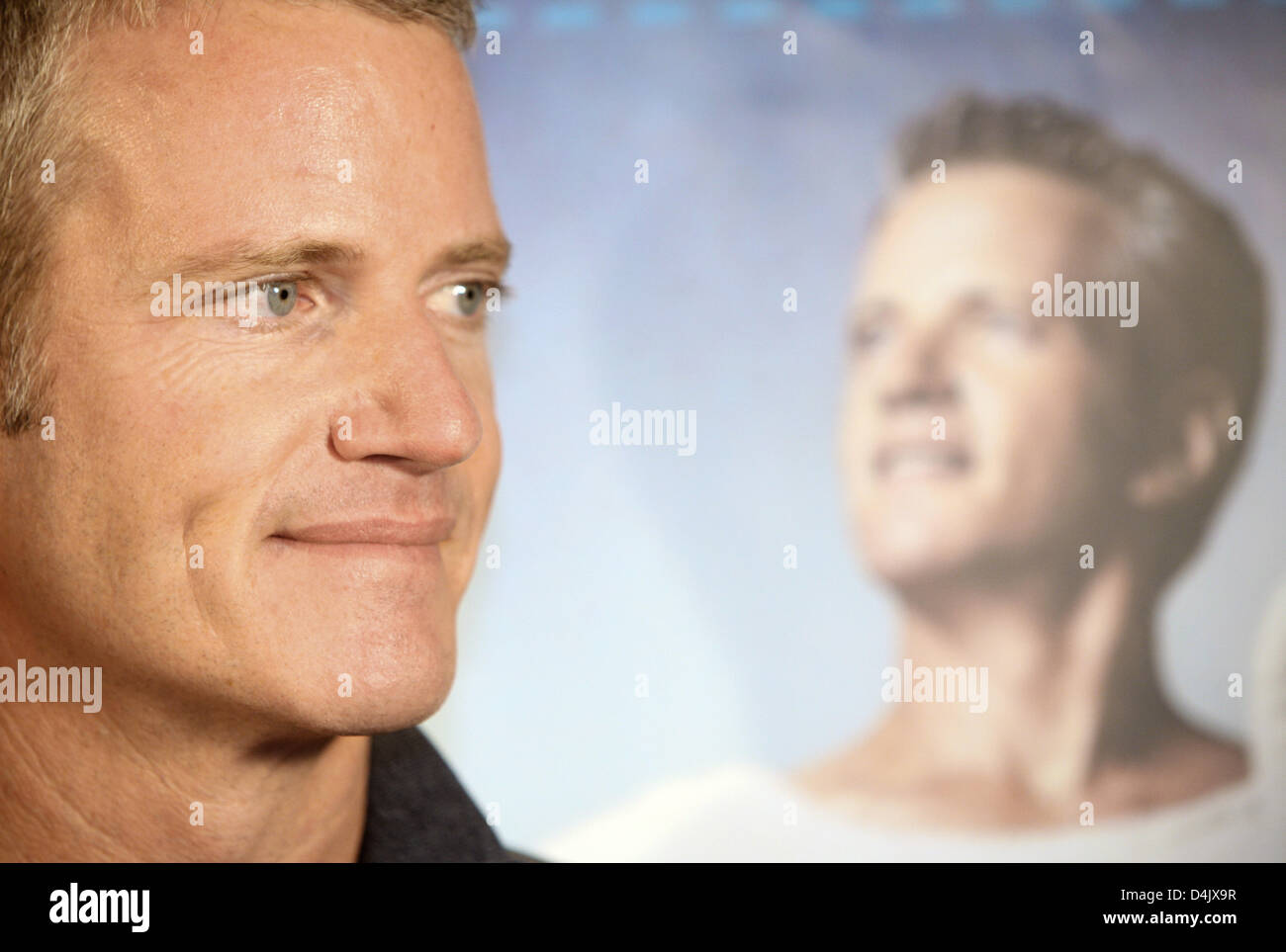 PETA vice president Dan Mathews stands in front of a poster showing his ...