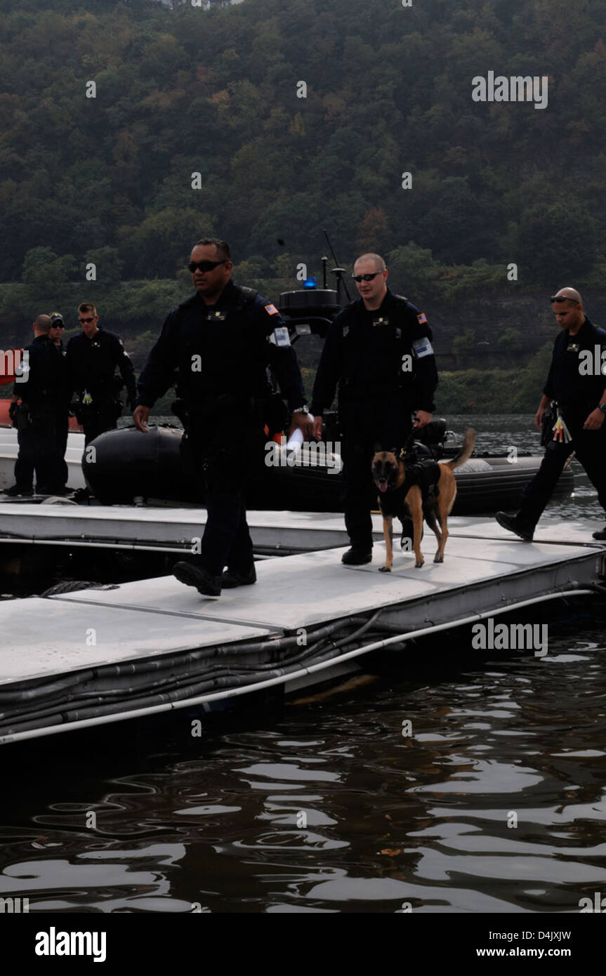 The U.S. Coast Guard's K9 unit, D.O.G. (Dog), disembarks after a ...