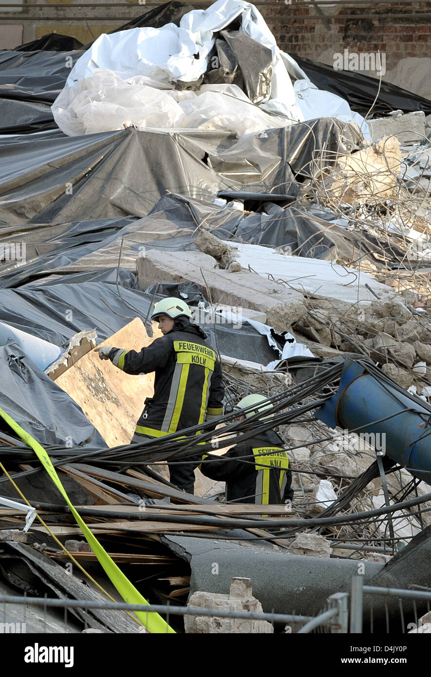 A firefighter pictured in the debris of the collapsed Historic City ...