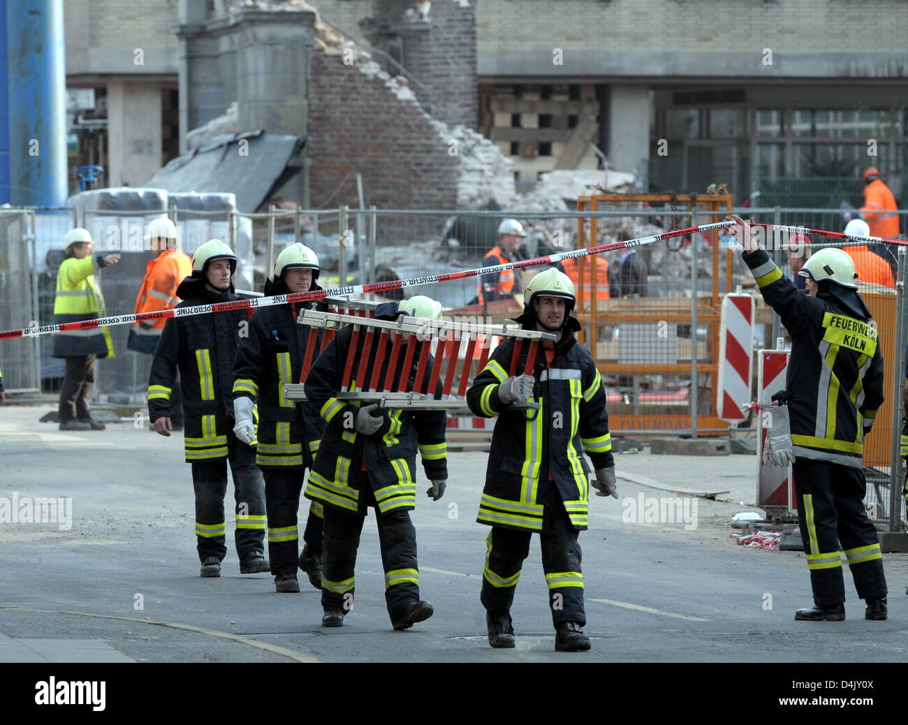 Firefighters return from the debris of the collapsed Historic City ...