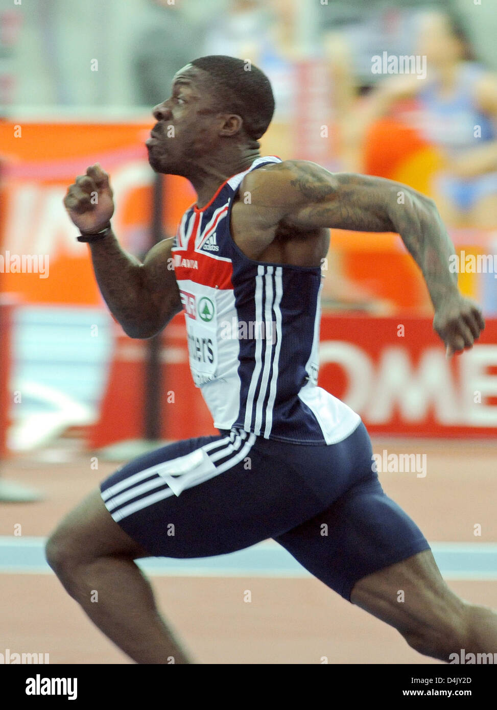 Britain?s Dwain Chambers (L) wins the gold medal in the 60 Metres ...