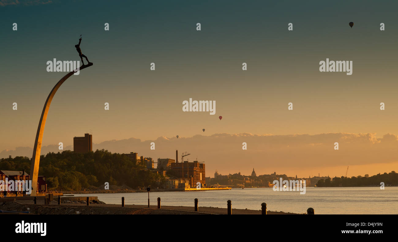 Curved pole overlooking coastal city Stock Photo - Alamy