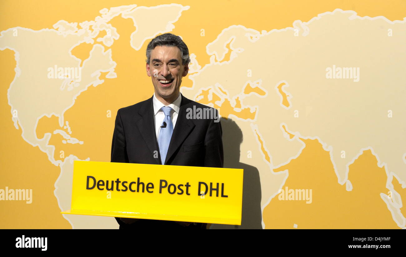 CEO of Deutsche Post DHL Frank Appel presents a sign with the company?s ...