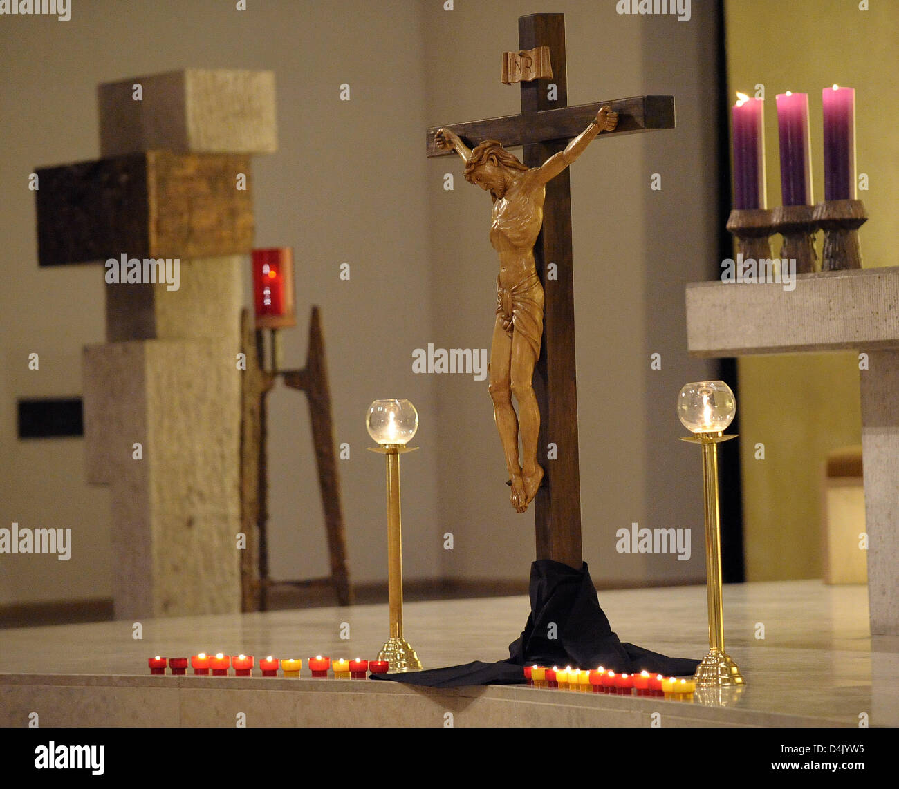 Candles are pictured in a church service in Winnenden, Germany, 11 ...