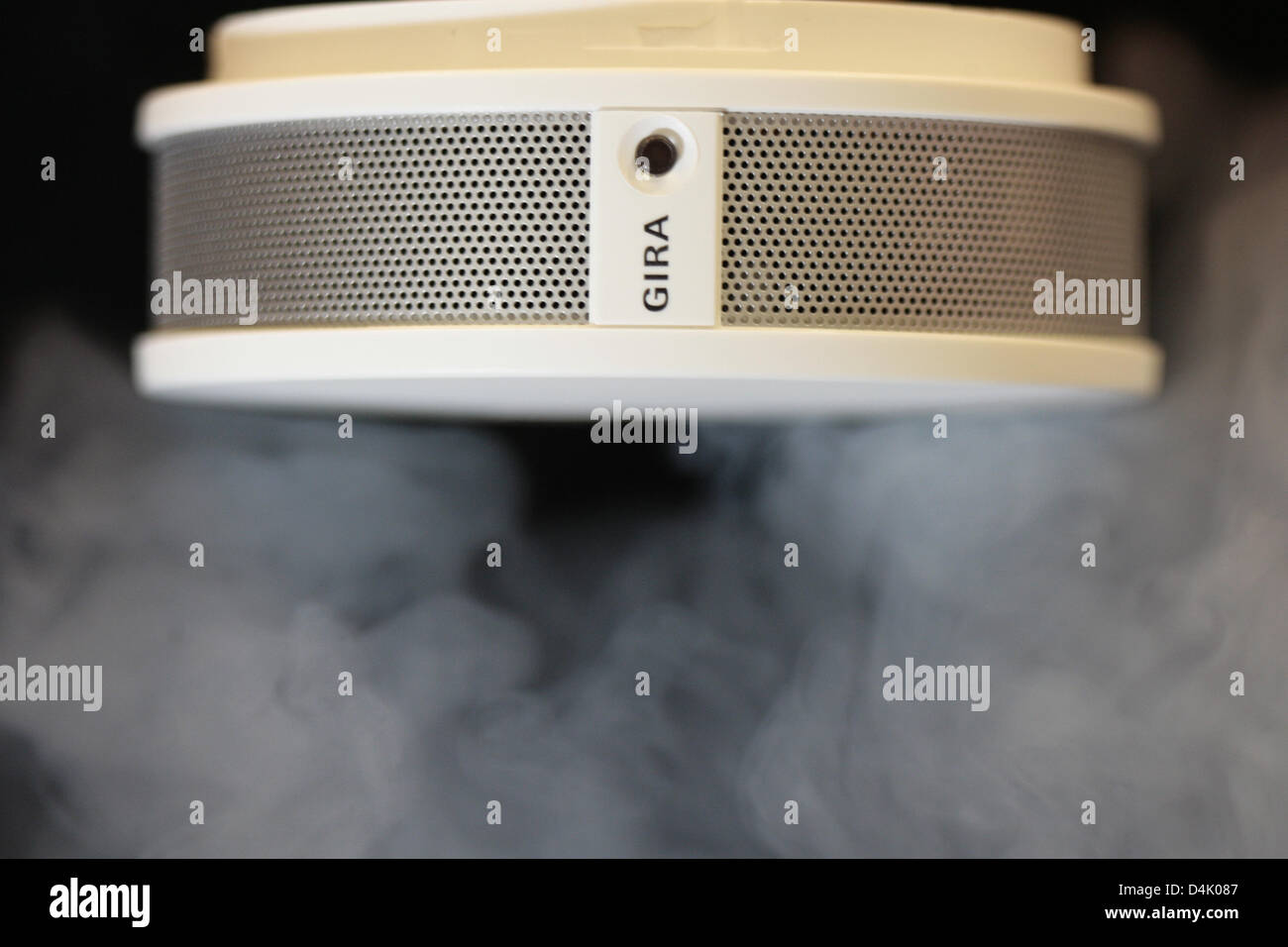 Smoke emerges around a smoke detector after a press conference of the ...