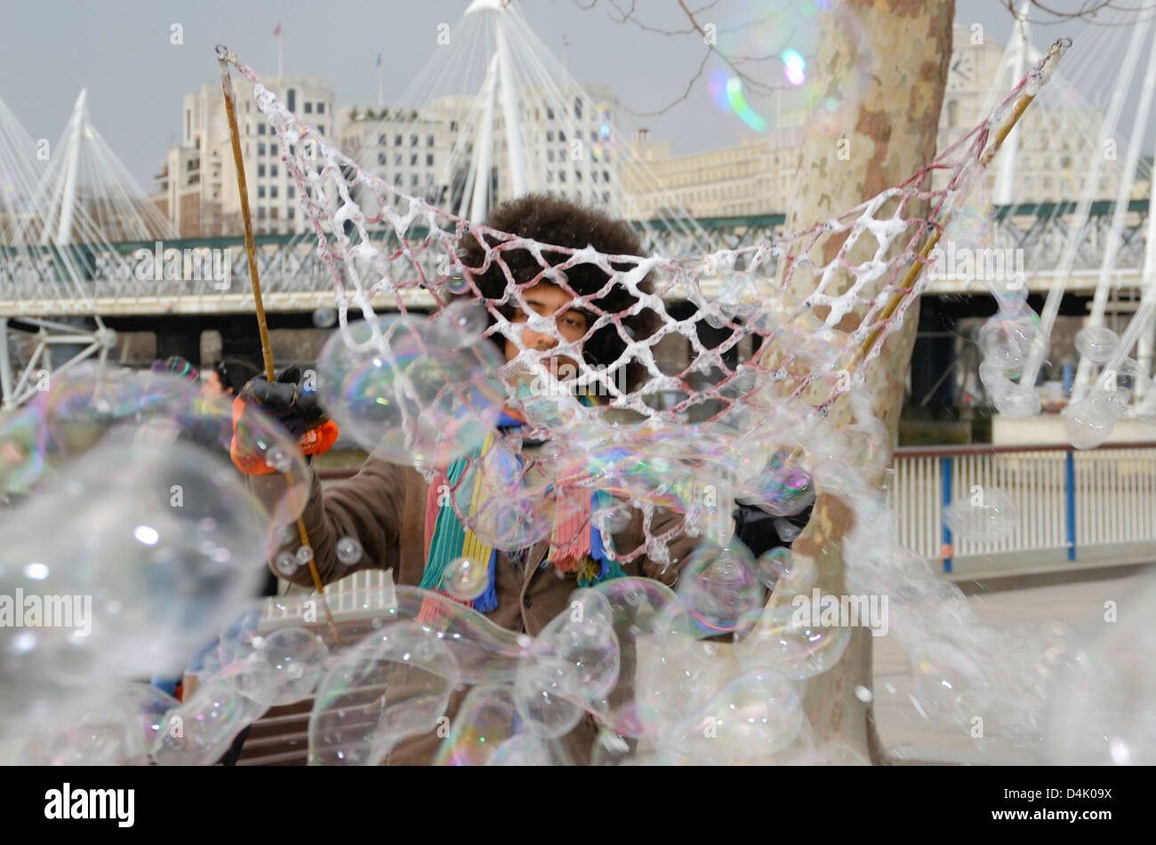 A street performer on the South Bank of the River Thames in London, UK ...