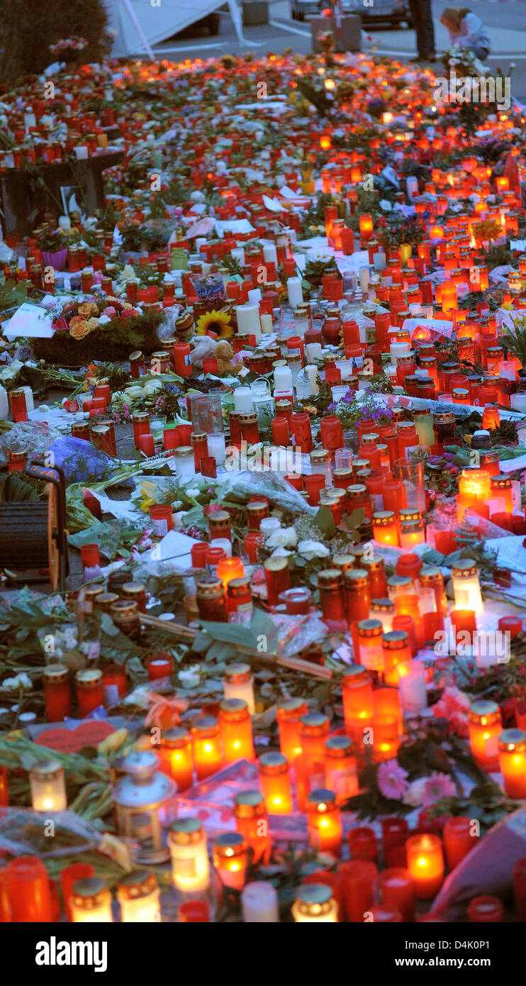 Hundreds of candles shine on the square in front of Albertville school ...