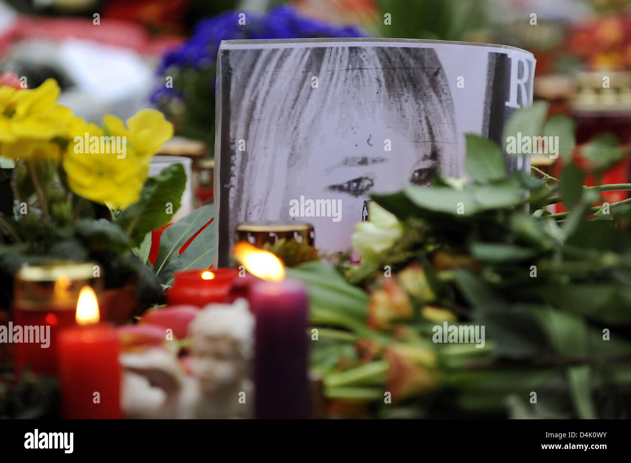 A photo of a victim and candles seen on the square in front of ...