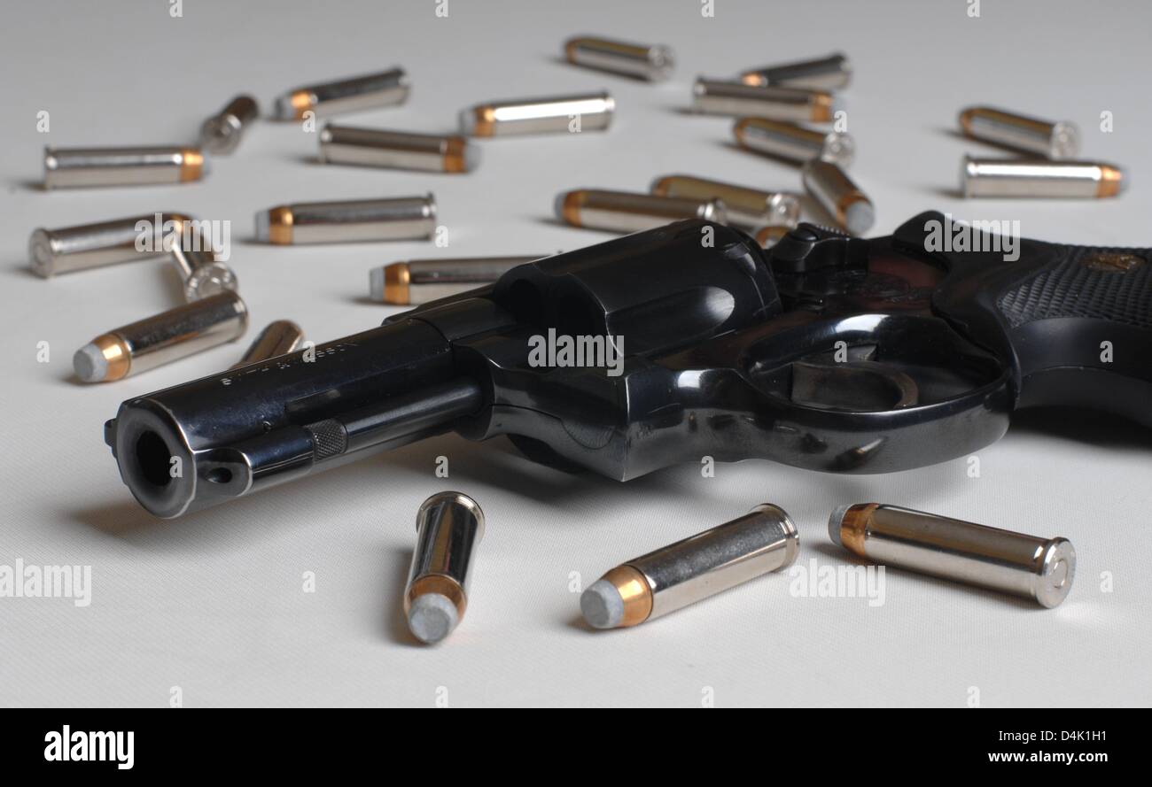 A revolver by Smith & Wesson and cartridges lie in Butzbach near ...