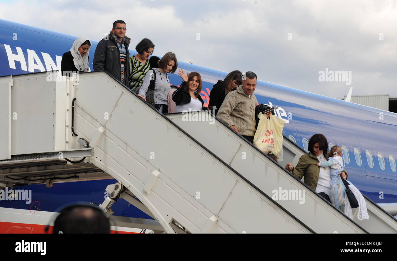 The first 122 refugees from Iraq get off the plane from Damascus on the ...