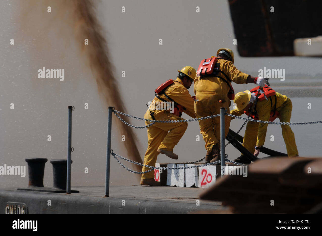 Crews work to shut in damaged wellhead Stock Photo - Alamy