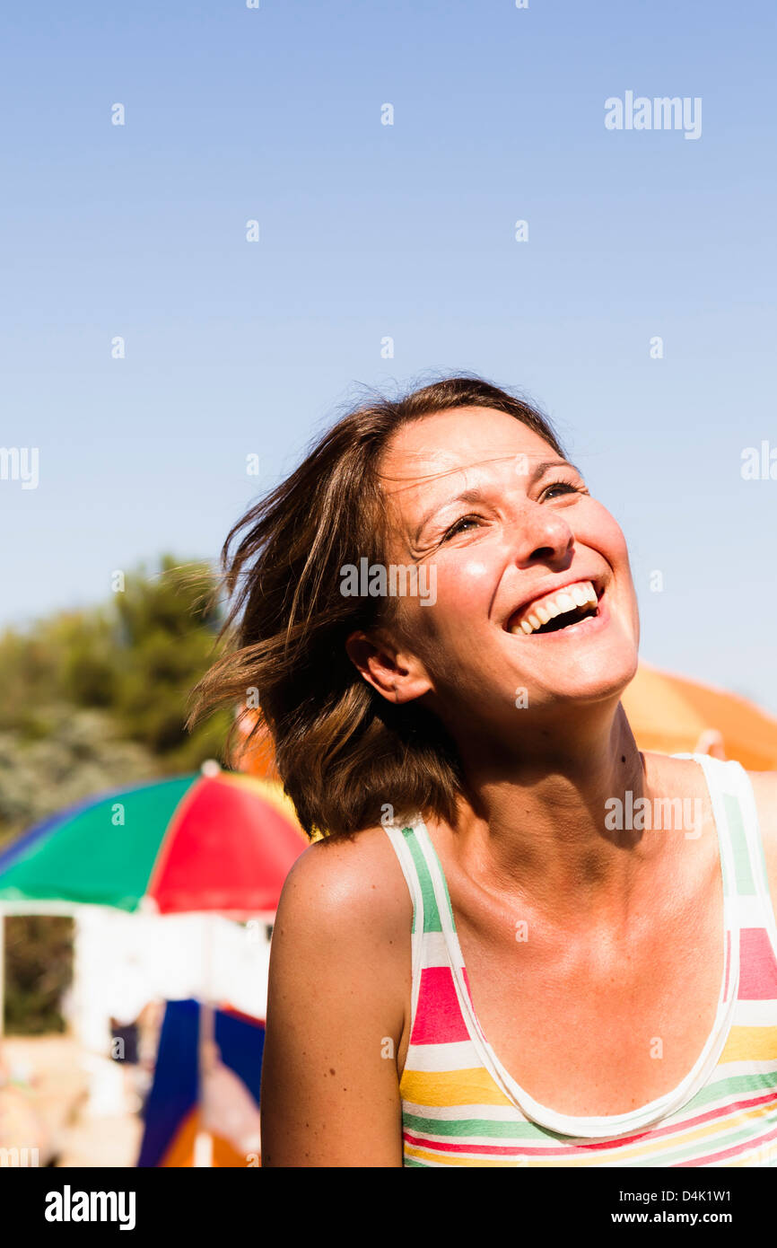 Smiling woman walking outdoors Stock Photo - Alamy