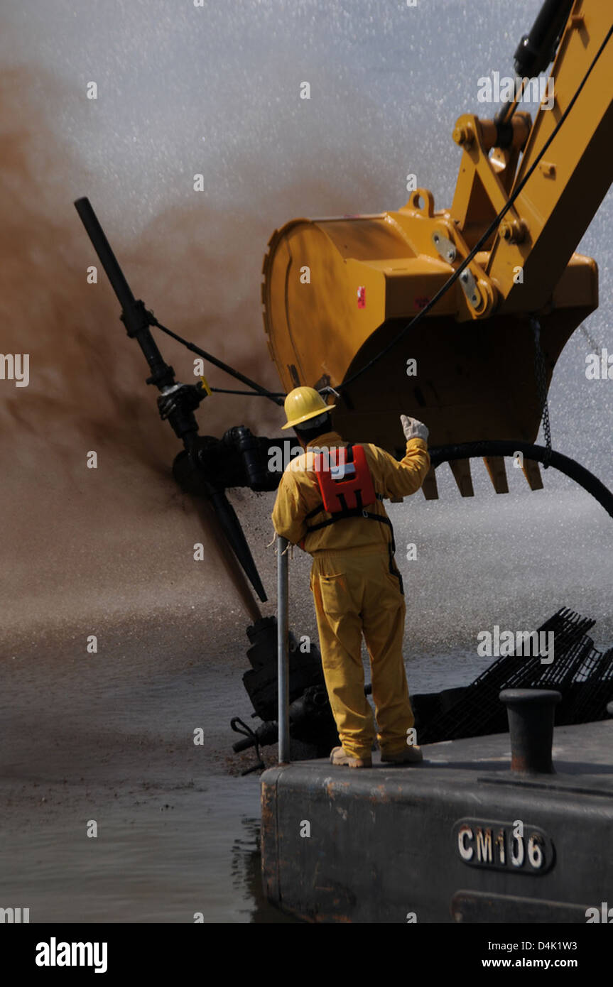 Crews work to shut in damaged wellhead Stock Photo - Alamy