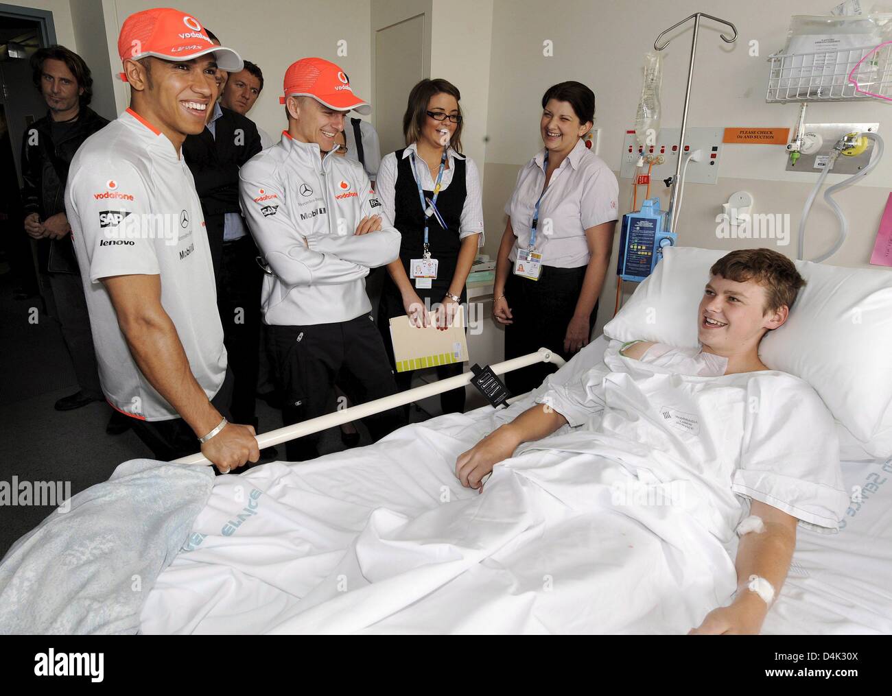 McLaren Mercedes Formula One driver Lewis Hamilton of Britain (C) and ...