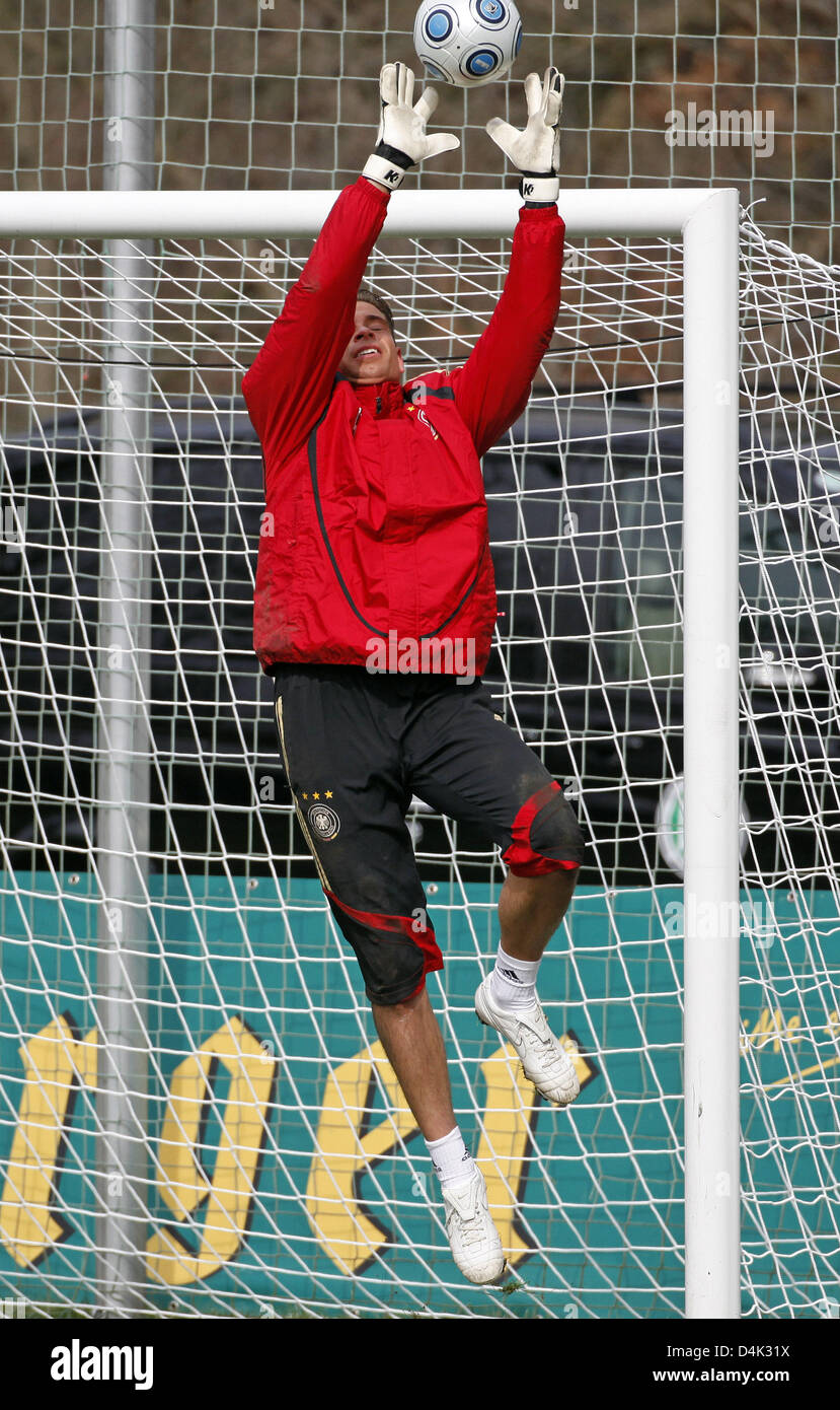 Goalkeeper of Germany?s national soccer team, Tim Wiese, reaches for ...
