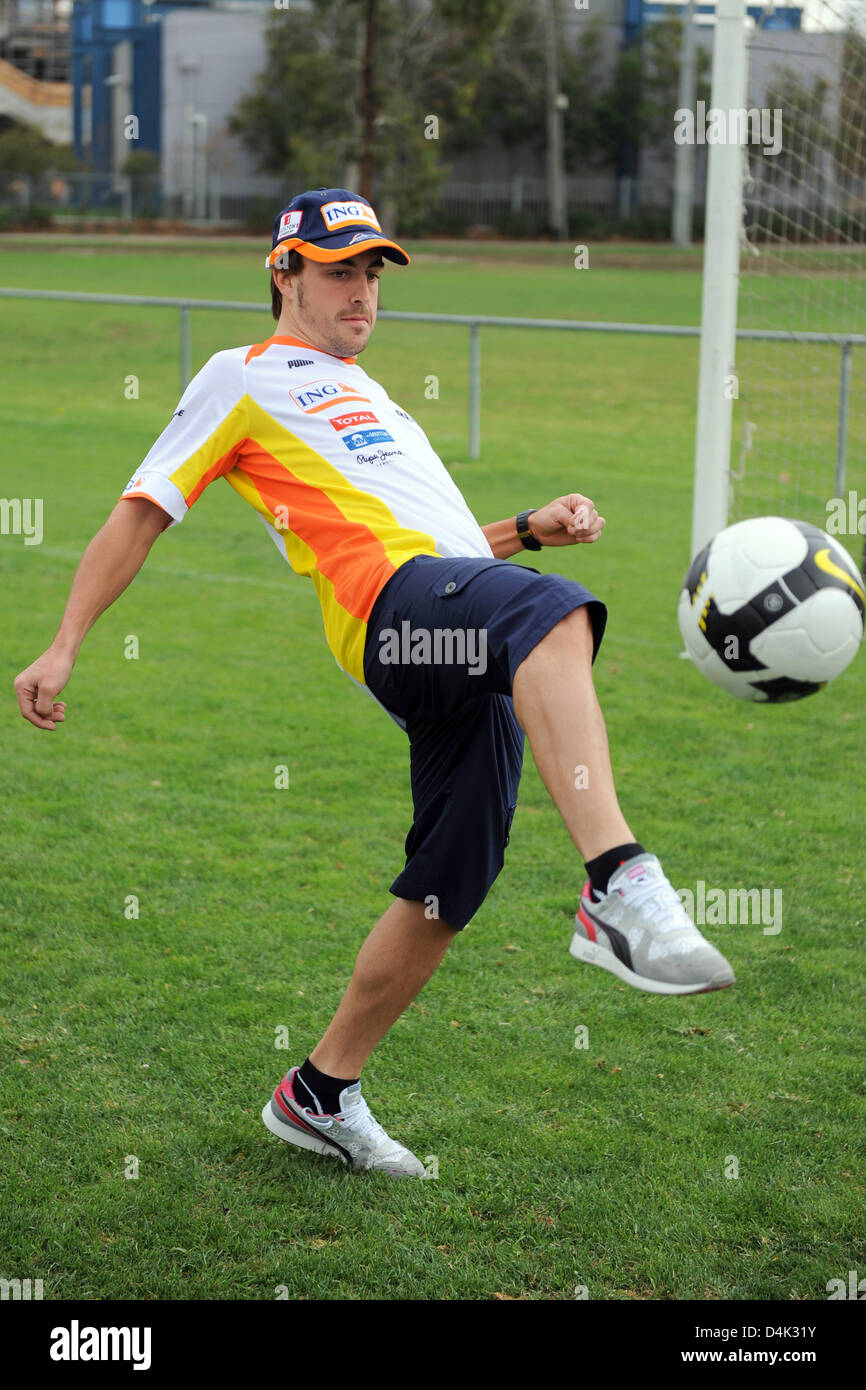 Spanish Formula One driver Fernando Alonso of Renault plays soccer in ...