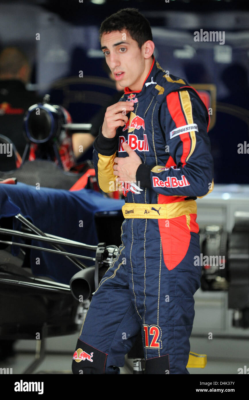 Swiss Formula One driver Sebastien Buemi of Team Toro Rosso stands in ...