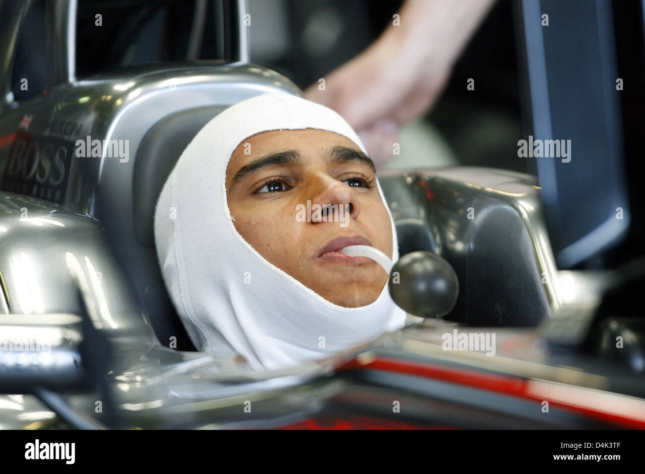 British Formula One driver Lewis Hamilton of McLaren Mercedes drinks ...
