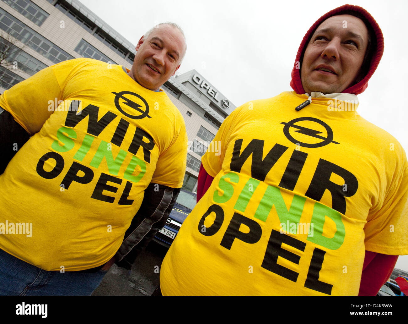 Two Opel-employees wear T-shirts reading ?We are Opel? in front of Opel ...