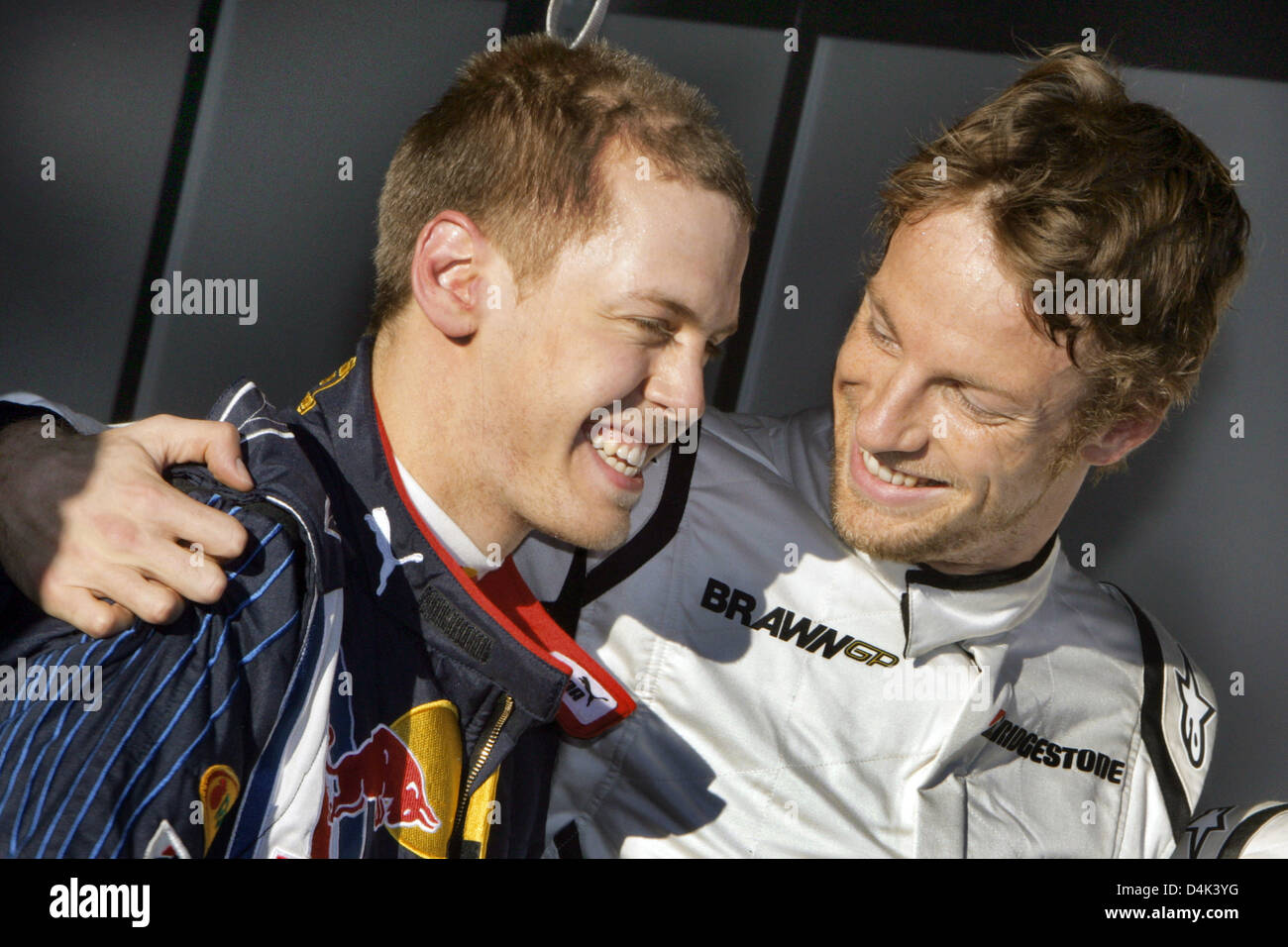 British Formula One driver Jenson Button (R) of Brawn GP hugs German ...