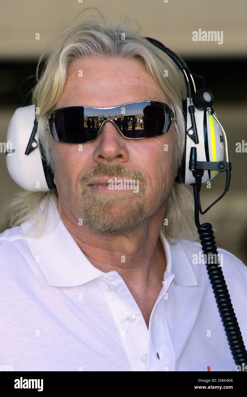 Virgin owner Sir Richard Branson is pictured inside the Brawn GP garage ...
