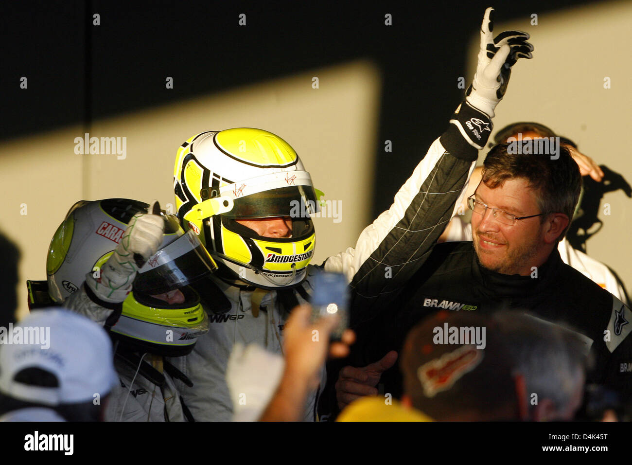 British Formula One driver Jenson Button (C) of Brawn GP and his ...