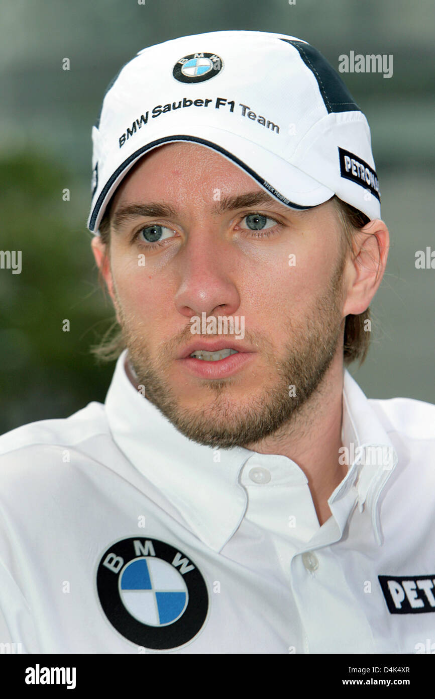German Formula One driver Nick Heidfeld of BMW Sauber poses in front of ...