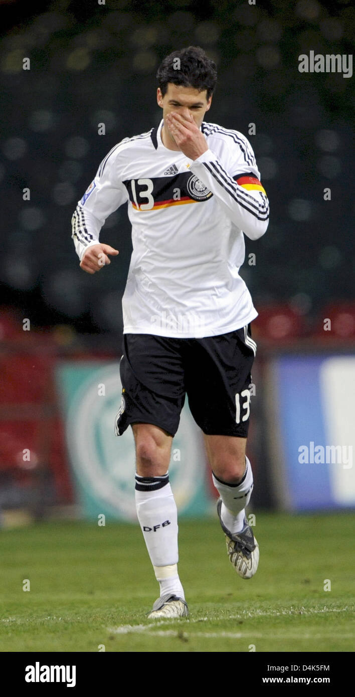 Germany?s captain Michael Ballack touches his face during the FIFA 2010 ...