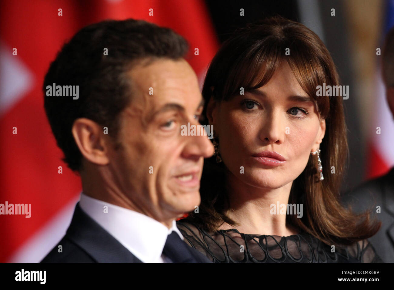 French President Nicolas Sarkozy (L) and his First Lady Carla Bruni ...