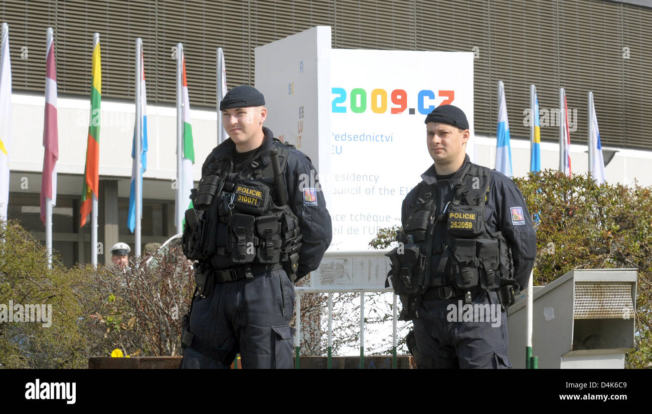 Czech special police forces stand guard in front of a poster ...