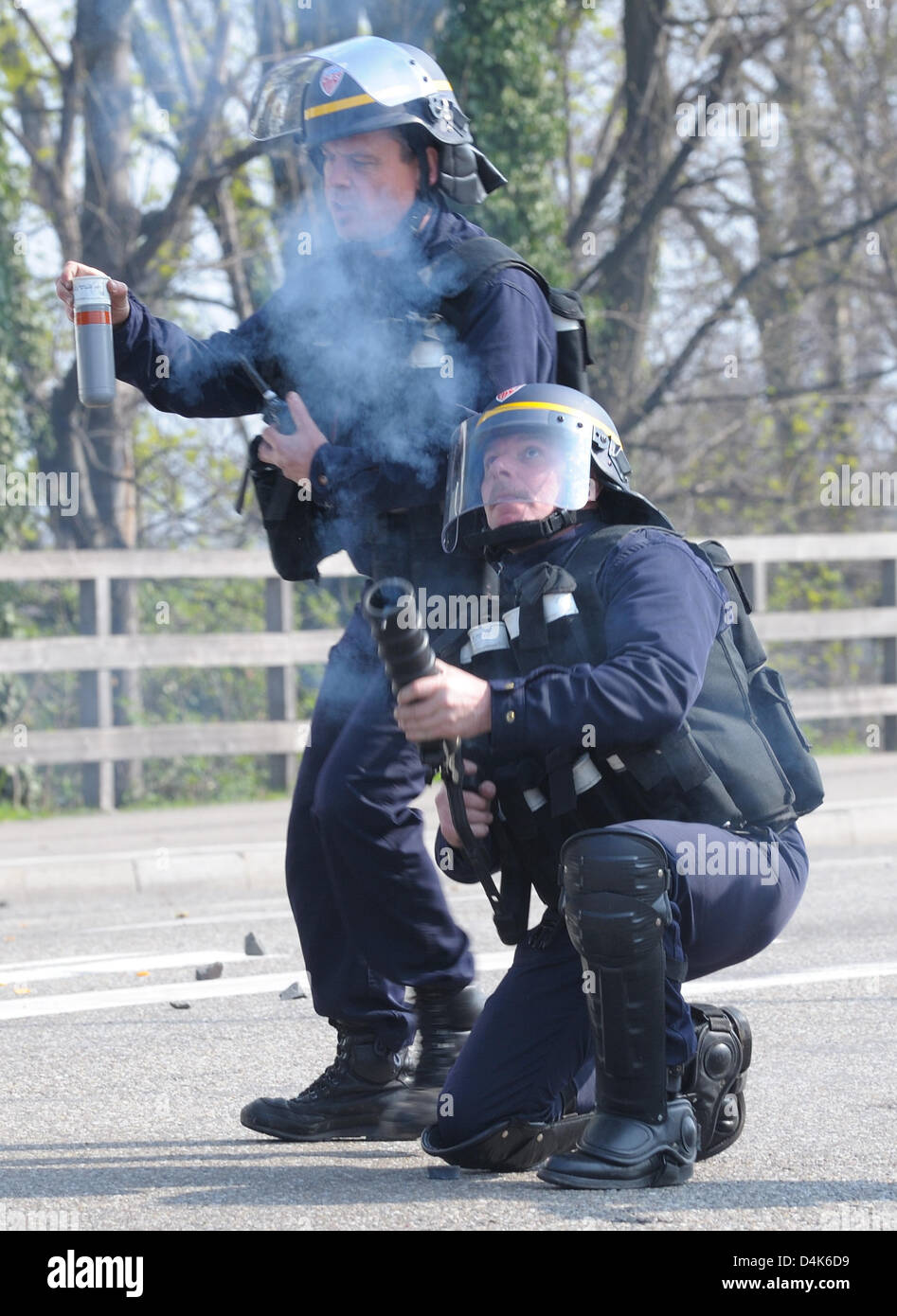 French police forces in riot gear fire off teargas as riots break out ...