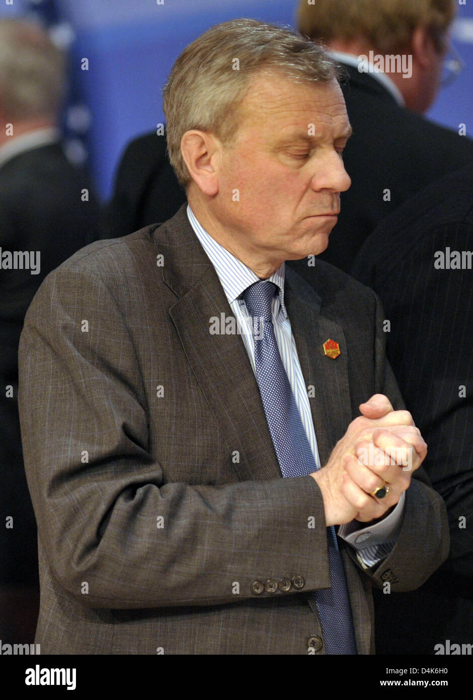 NATO Secretary-General Jaap de Hoop Scheffer folds his hands during the ...