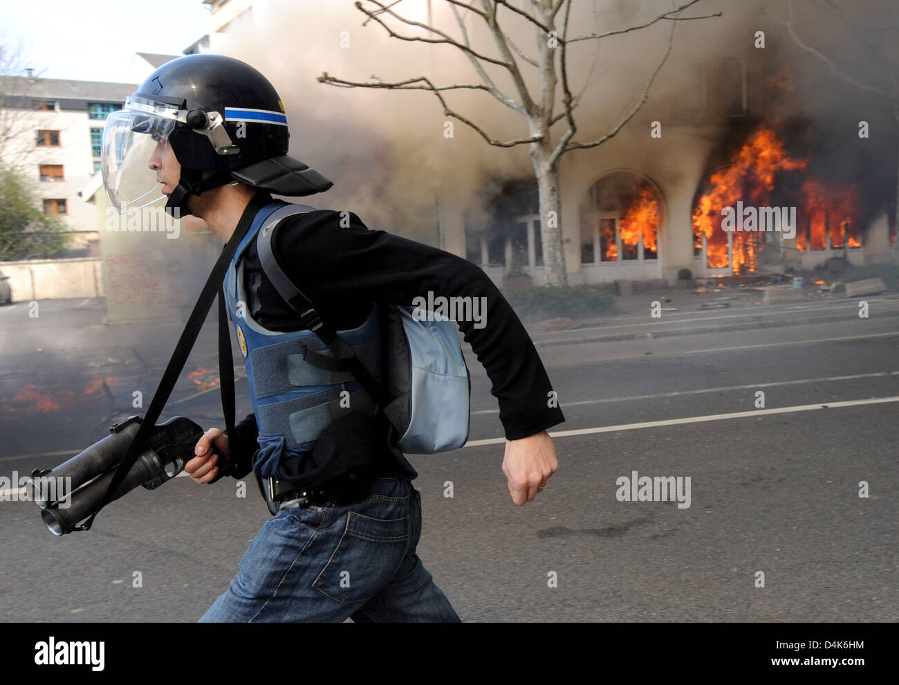 Police forces in riot gear march at the 2009 NATO Summit in Strasbourg ...