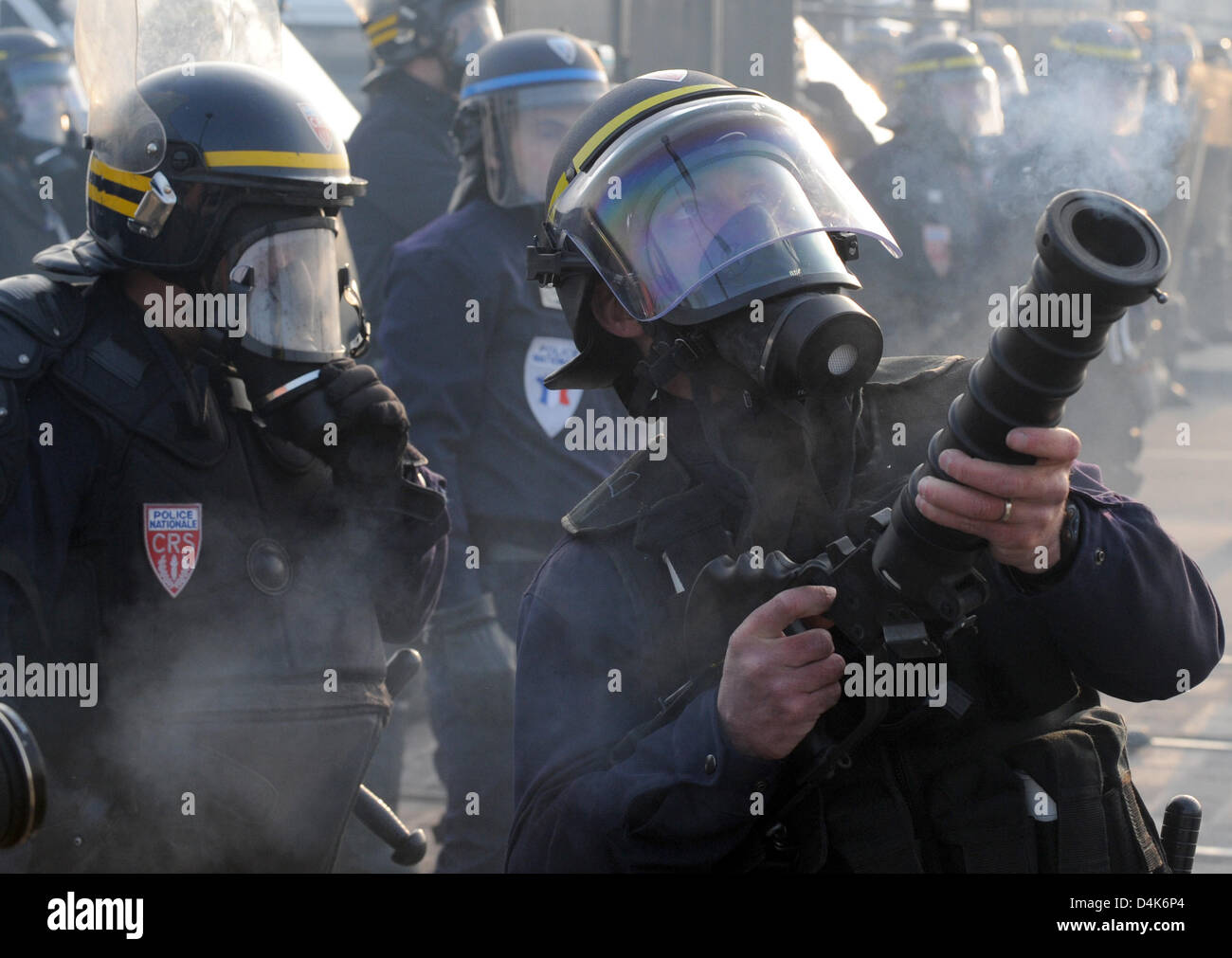 Police forces in riot gear fire tear gas at the 2009 NATO Summit in ...