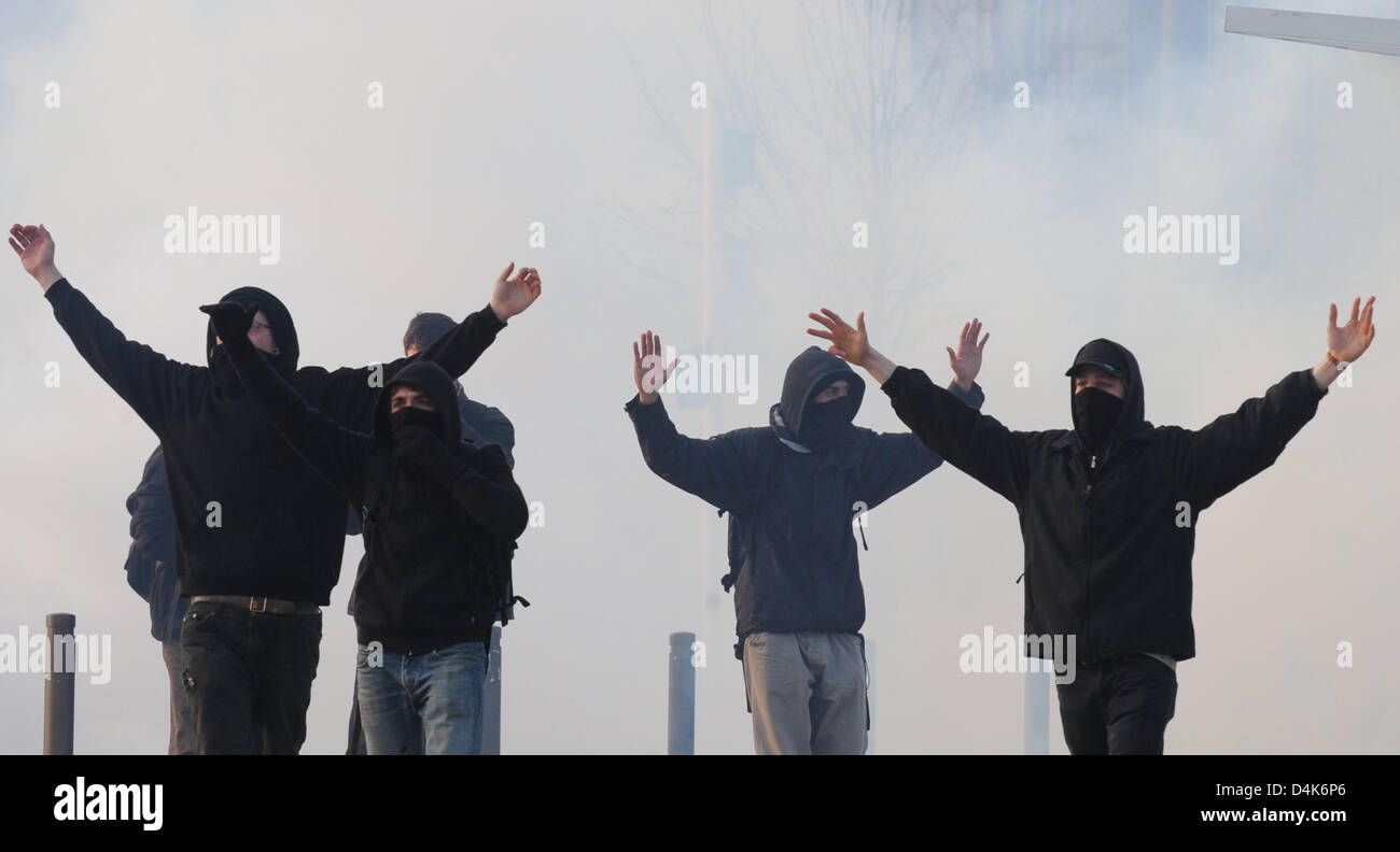 Police forces in riot gear and demonstrators clash at the 2009 NATO ...