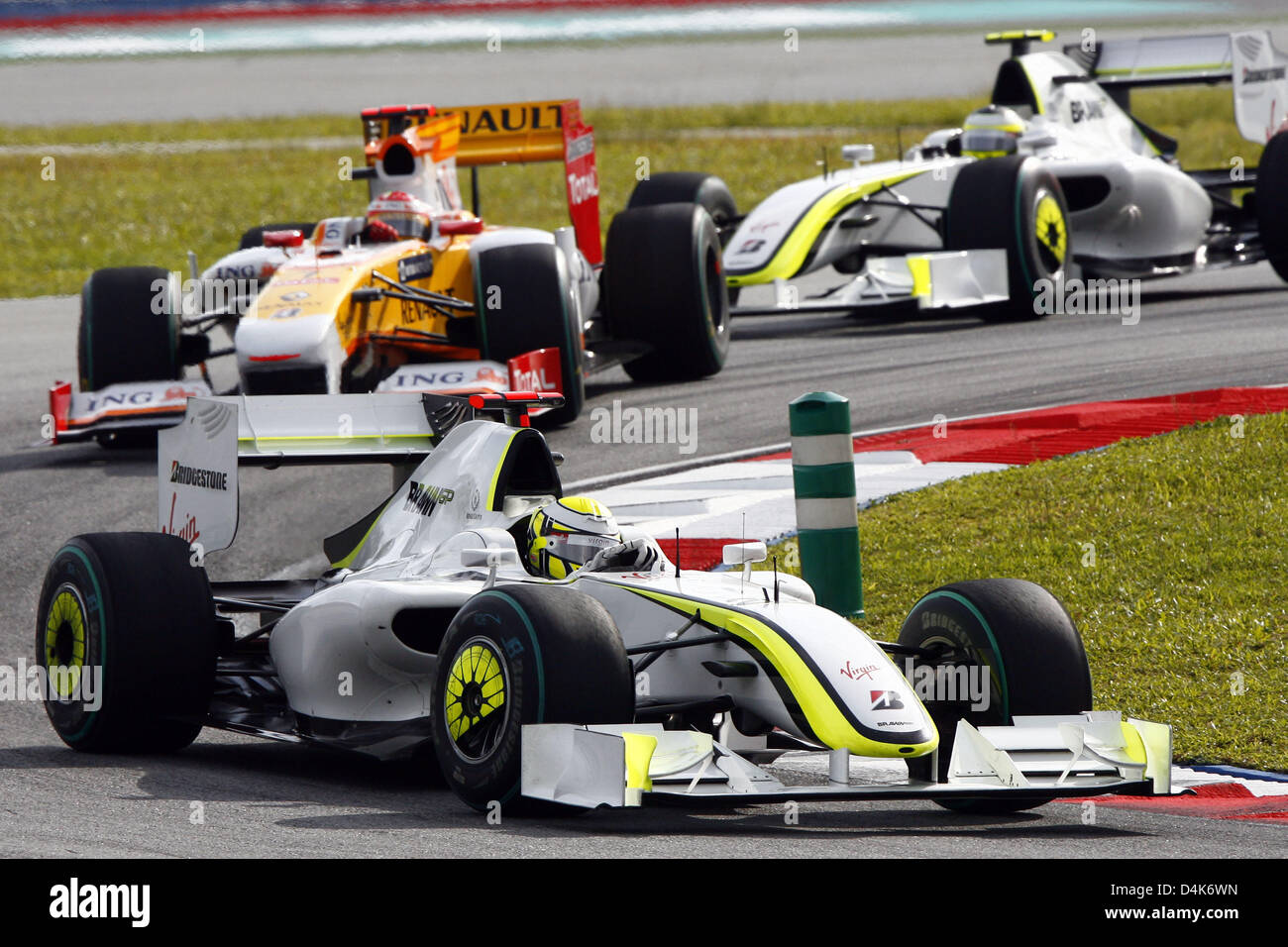 British Formula One driver Jenson Button of Brawn GP (front) enters a ...