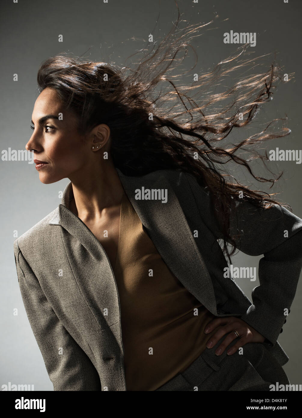 Side profile of woman with her hands on her hips hi-res stock ...