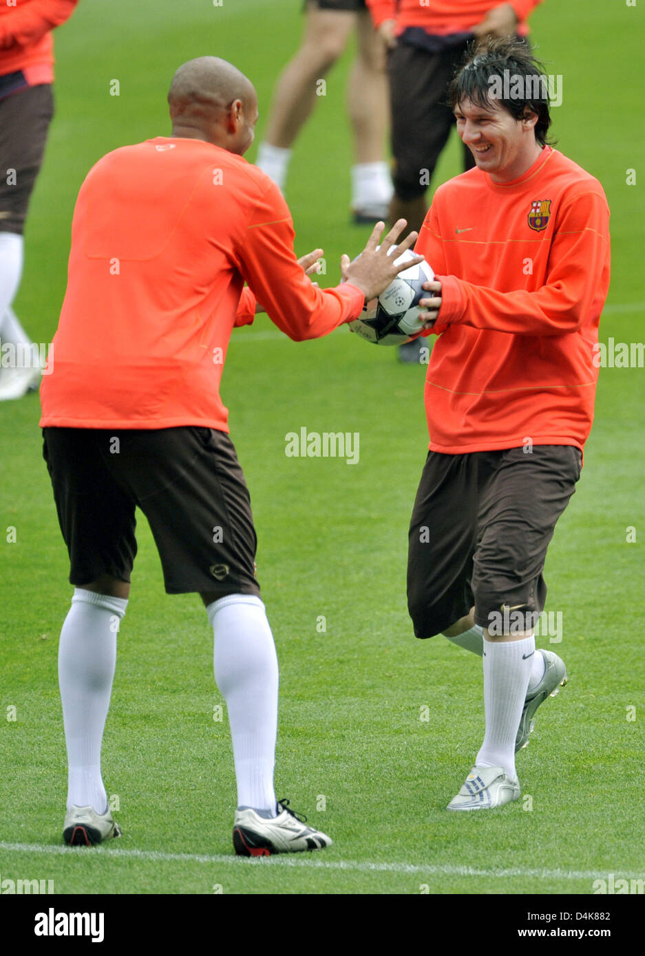 Spanish Primera Division club FC Barcelona?s Lionel Messi (R) and ...