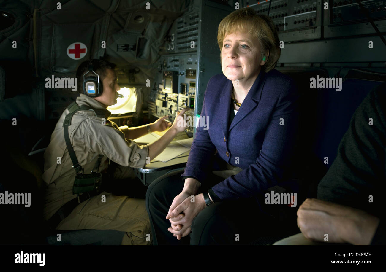 German Chancellor Angela Merkel smiles onbaord a German air force plane ...