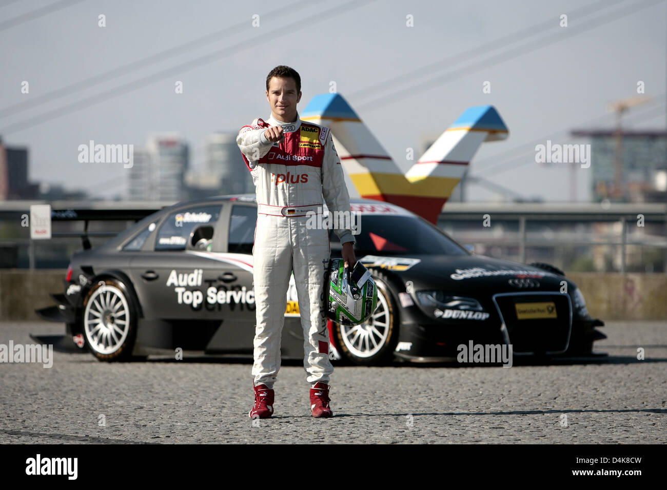 German race driver Timo Scheider of Audi poses with his race car prior ...
