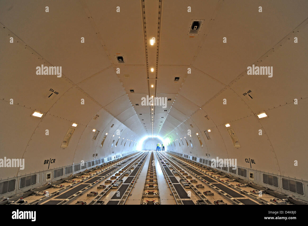 Worker check the interior of a Boing 777F cargo plane of the airline ...