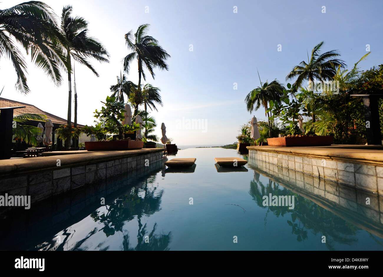 The picture shows the pool area and the park-like green space of the ...