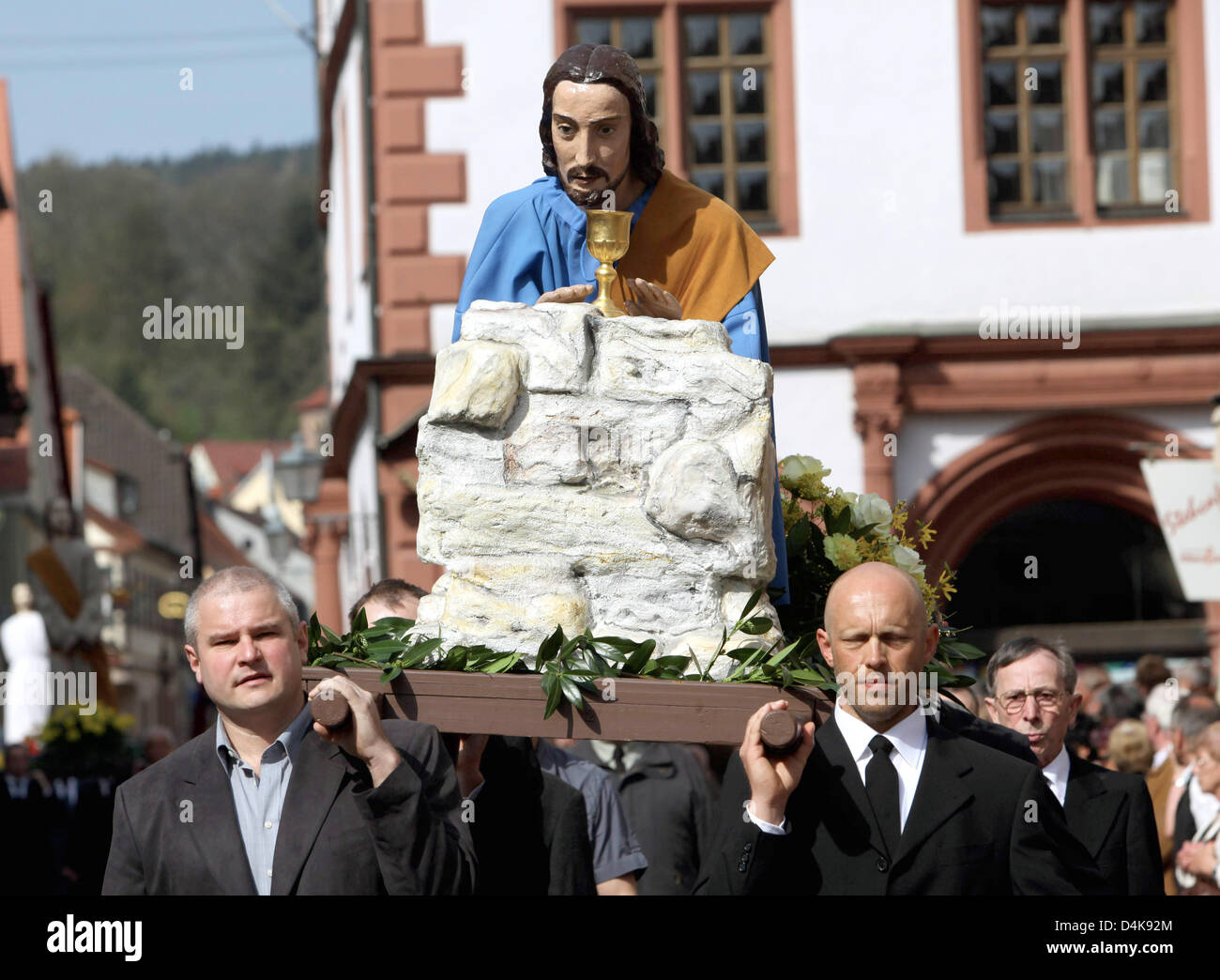 A figure of Jesus Christ is carried during the Good Friday procession ...