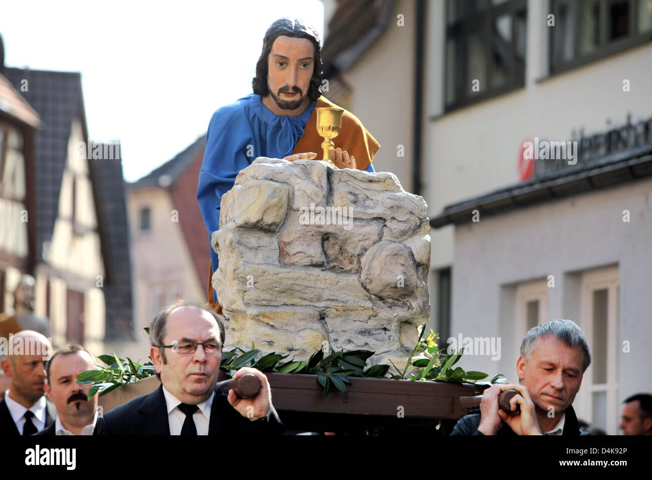 A figure of Jesus Christ is carried during the Good Friday procession ...