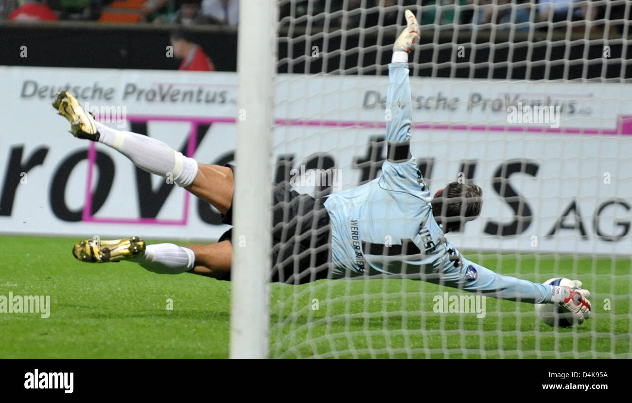 Bremen?s goalkeeper Tim Wiese saves a ball during the first leg of the ...