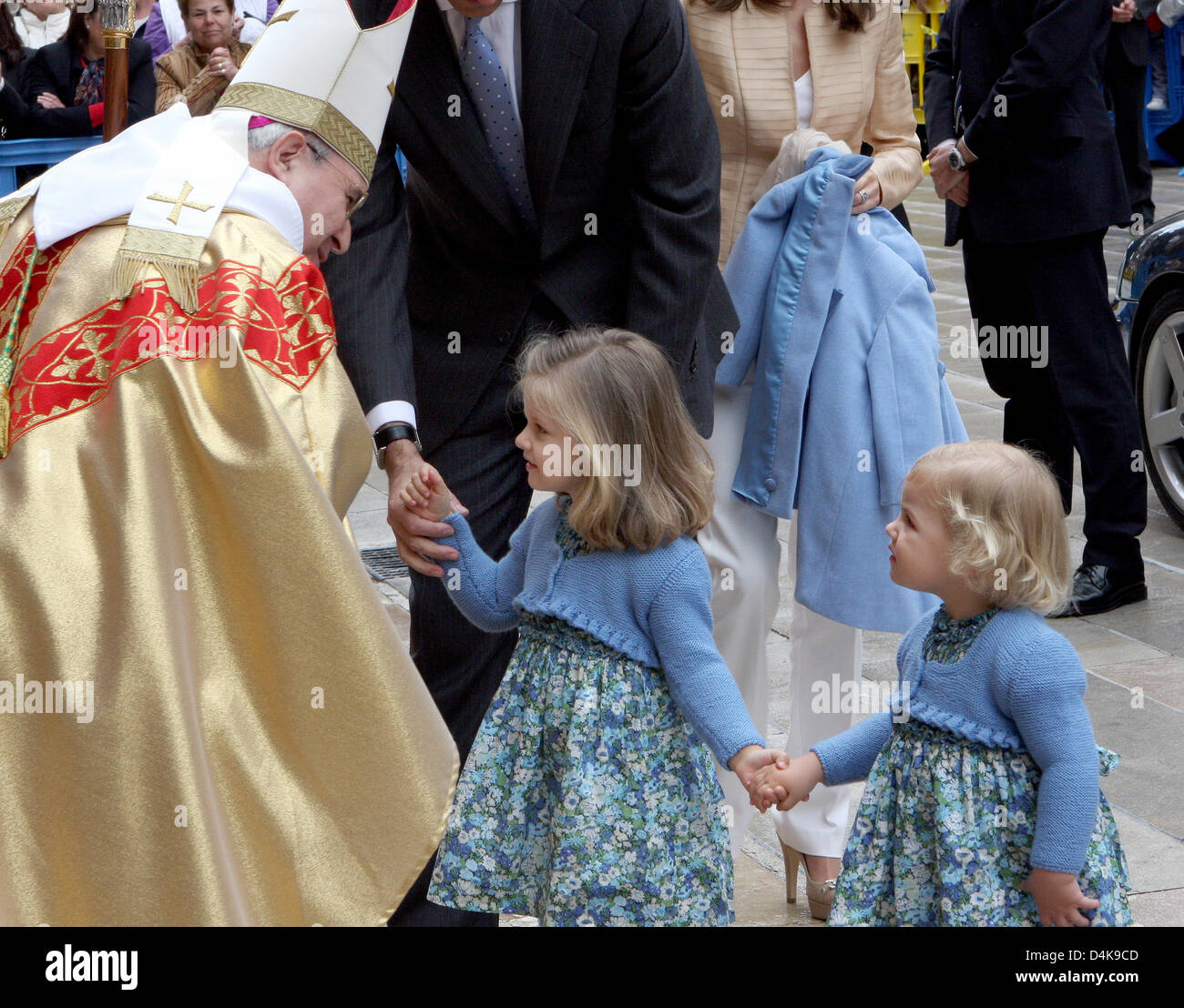 Spanish Princesses Sofia (R) and Leonor pictured with a cleric prior to ...