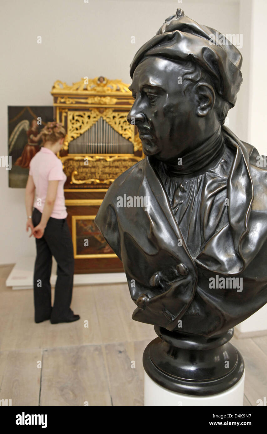 A visitors to the re-opened Handel House eyes a positive organ in the ...