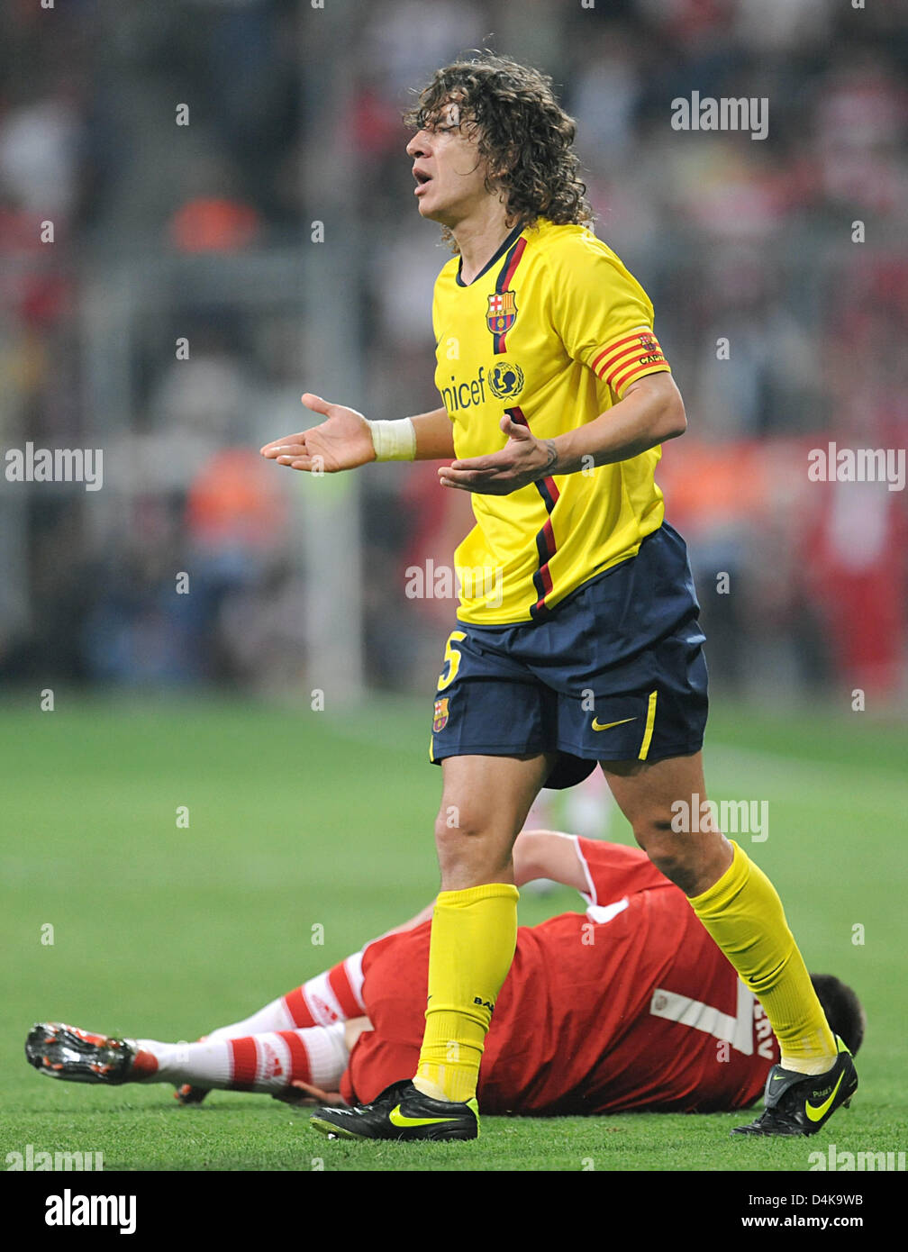 Barcelona?s Carles Puyol gestures after playing foul against Munich?s ...