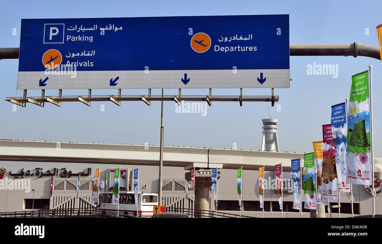 A sign gives directions for the arrival and departure terminals at the ...
